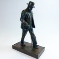 Solid bronze statue of Winston Churchill walking along with a walking ...