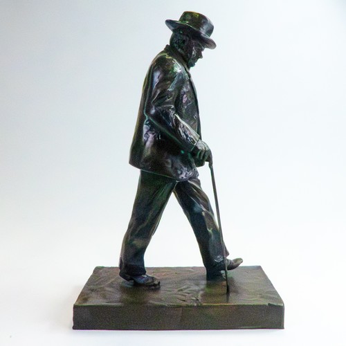 Solid bronze statue of Winston Churchill walking along with a walking ...