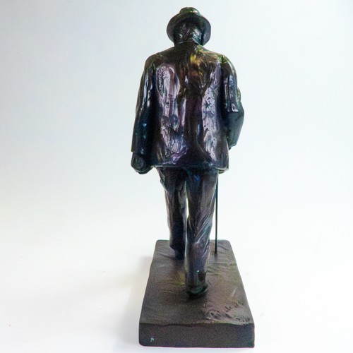 Solid bronze statue of Winston Churchill walking along with a walking ...