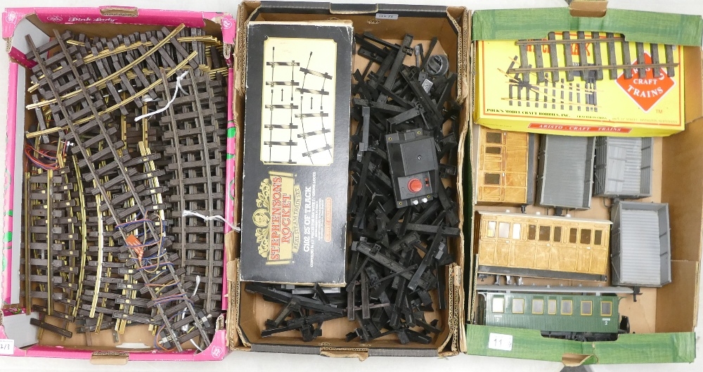 A collection of G scale rolling stock, train track and accessories. (3 ...
