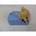 A Michelin man bakelite money box (these boxes were given to Michelin ...