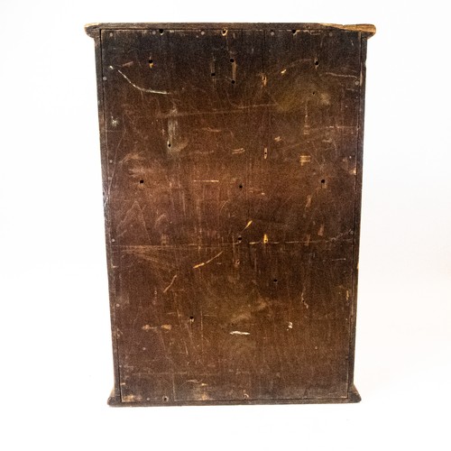 An early 20th century 'Flick Ball' penny slot machine, housed in a ...