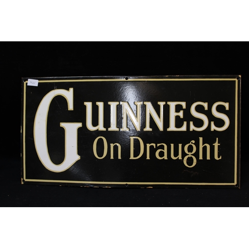 An original Guinness enamel sign - 60.5cm x 33.5cm