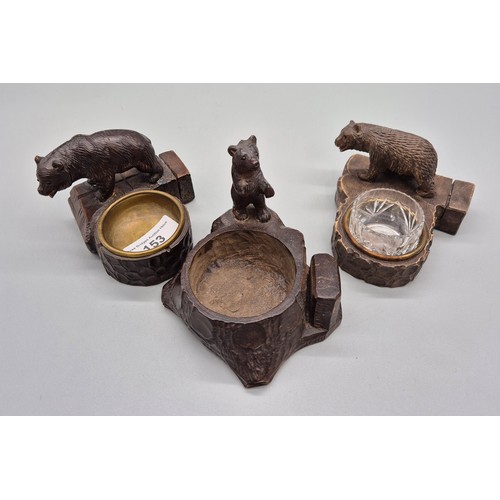 Three Antique black forest hand carved bear figure pots, two having ...