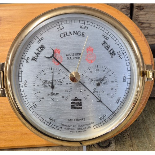 A Sewills of Liverpool, ships brass bulkhead clock & barometer mounted ...