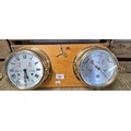 A Sewills of Liverpool, ships brass bulkhead clock & barometer mounted ...