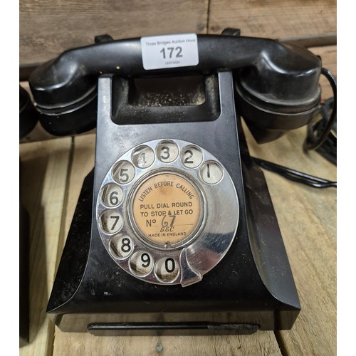A collection of two antique/ vintage black Bakelite telephones.