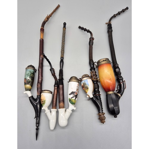 A collection of vintage Bavarian hand painted ceramic smoking pipes ...