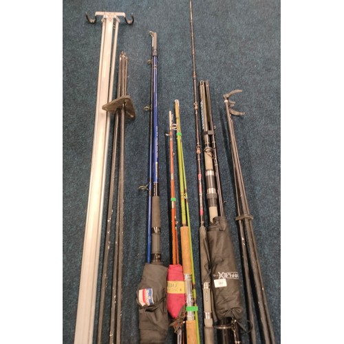 A selection of fishing rods & stands; Ron Thomson rod, Daiwa fishing ...