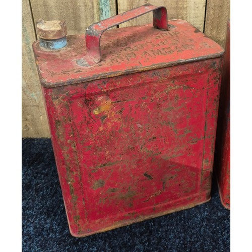 A collection of four vintage Esso & Shell petrol cans