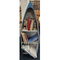 Boat shaped shelving unit containing two carved wooden sailor figures ...