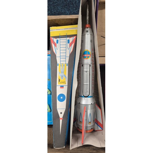 A Crate of tin plate toys; Tin plate rocket, San Francesco tours toy ...