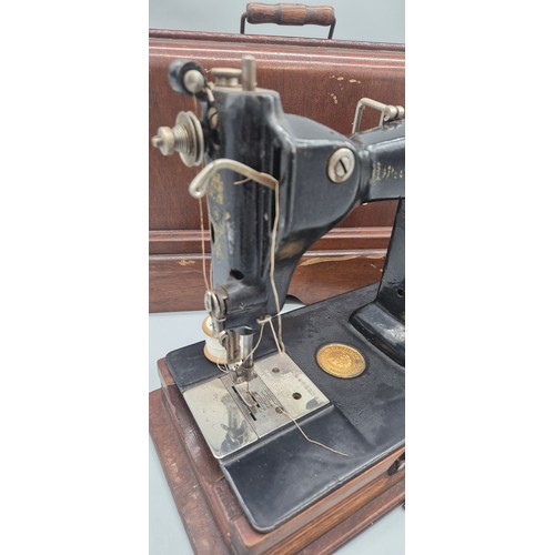 Antique Wheeler & Wilson Sewing machine with fitted wooden casing & key