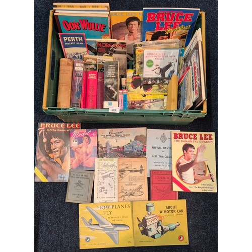 A crate of books, magazines and annuals; More Eves without Leaves ...