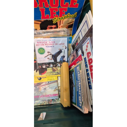 A crate of books, magazines and annuals; More Eves without Leaves ...