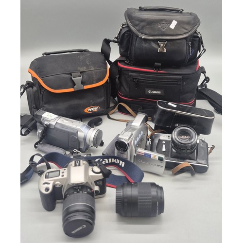 Selection of cameras and camcorders; Canon EOS500 with lenses and carry ...
