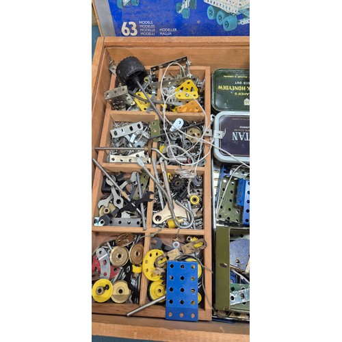 Collection of Vintage Meccano. Includes Manuals and loose parts.