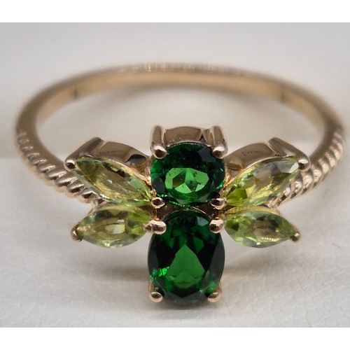 9ct yellow gold and green gem stone ring. Gems form a bug shape. Ring ...