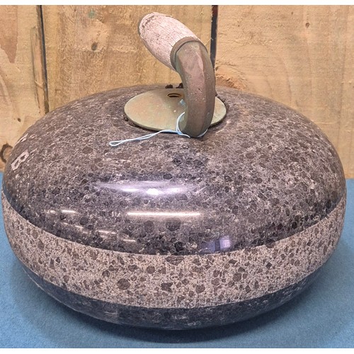 Pair of two early 20th century curling stones with handles. Having ...