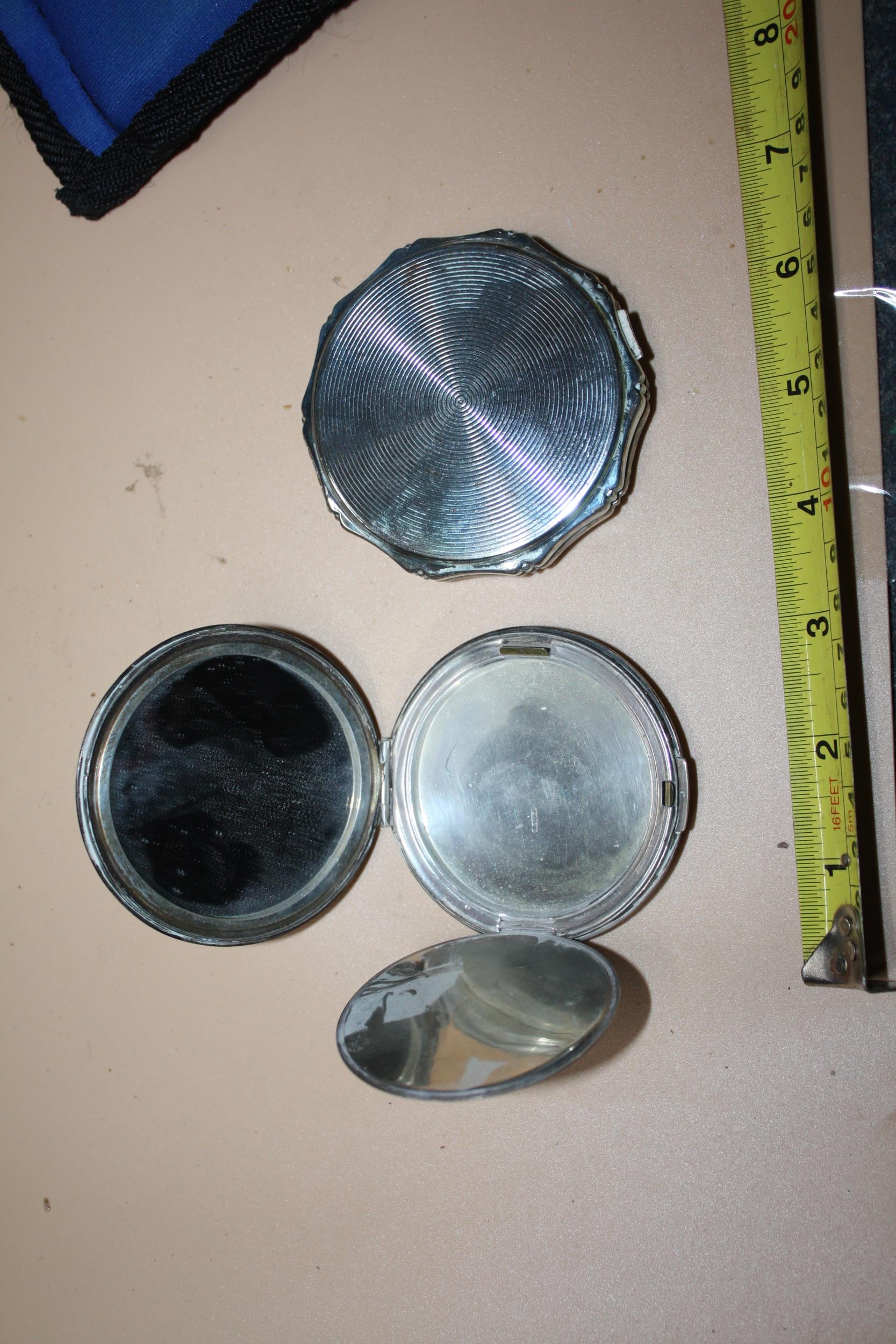 Circular silver compact- marks rubbed & chrome compact