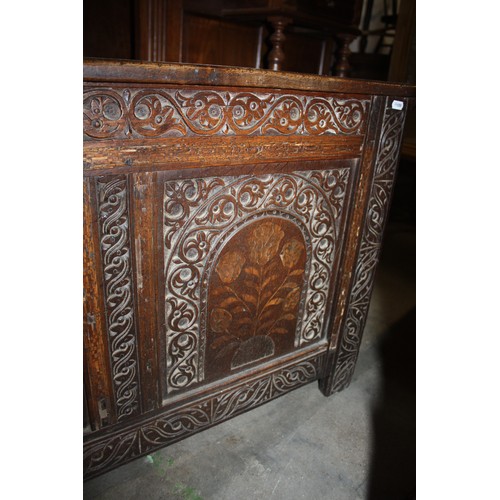 Early 18th Century oak coffer with triple panelled front decorated with ...