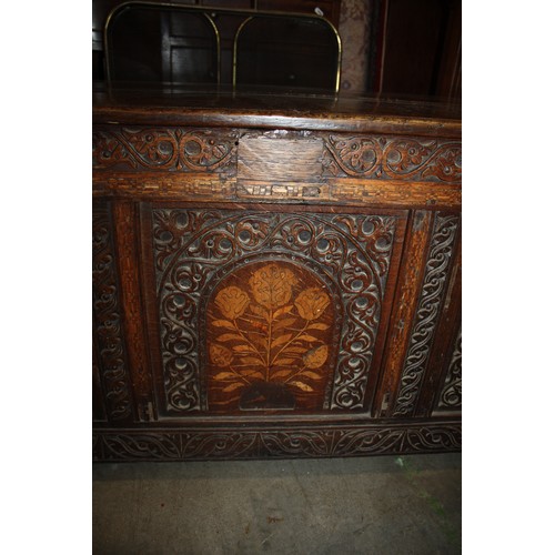 Early 18th Century oak coffer with triple panelled front decorated with ...