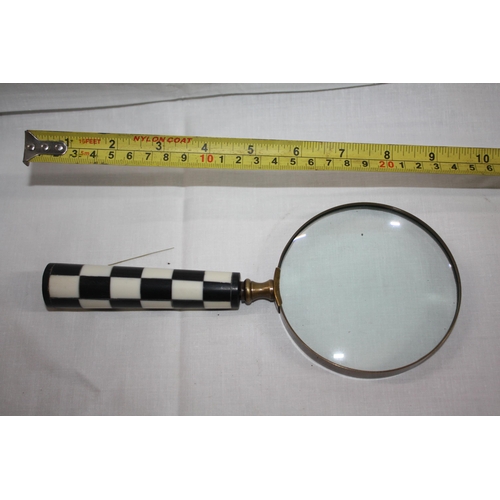 Chequered handled magnifying glass