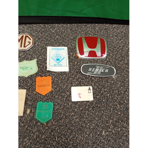 Collection of vintage caravanning and motoring badges.