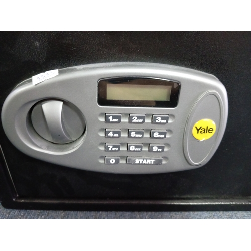A yale combination safe.
