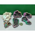A collection of 5 celestial aura geodes and 2 bismuth crystals.