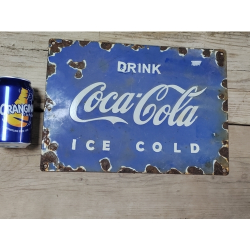 A vintage blue and white enamel Coca-Cola sign. H 25cm x W 36cm