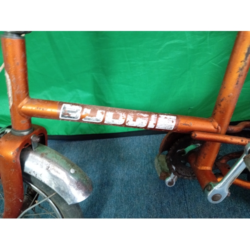 A vintage Raleigh budgie bicycle.