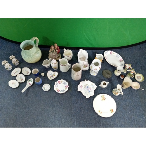 A job lot of ceramics, including a jug, plates, cups, and three figurines