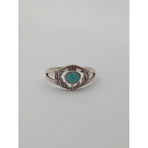 A stamped 925 silver thistle ring. Size R.