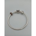 A stamped 925 silver charm bracelet with a Pandora chef charm.