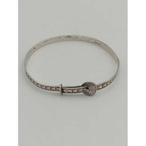 A stamped silver adjustable bangle and a bracelet made from sterling ...