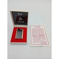 A vintage 1970s Noble electronic butane lighter and original sales receipt.