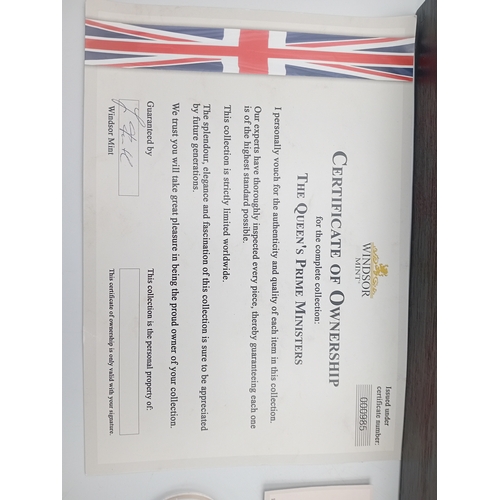 A boxed Windsor Mint The Queen's prime ministers gold plated coin set ...
