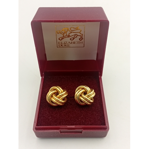 A pair of hallmarked 375 9ct gold knot earrings in a Elizabeth Duke box.