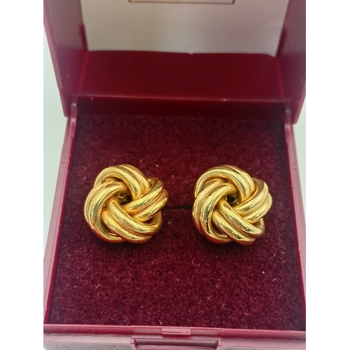 A pair of hallmarked 375 9ct gold knot earrings in a Elizabeth Duke box.
