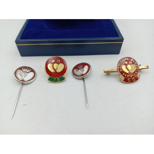 A collection of 3 silver, silver gilt & white metal National Blood ...