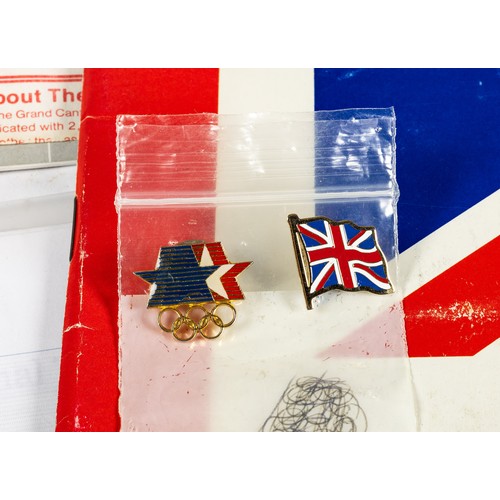 A collection of ephemera, includes two Silverstone badges from 1975, a ...