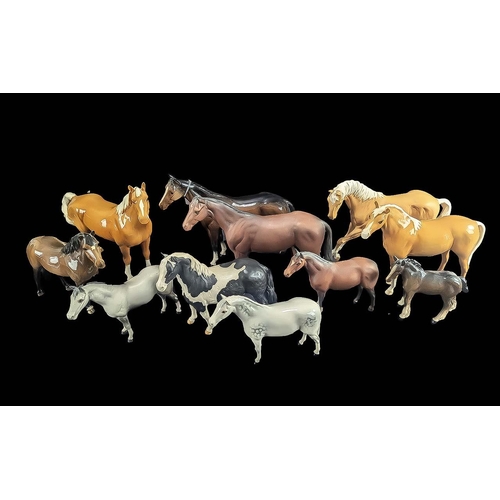 Collection of Thirteen Beswick Horses, includes Palominos, greys, brown ...