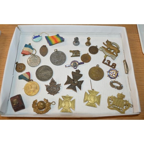 tray of assorted military badges