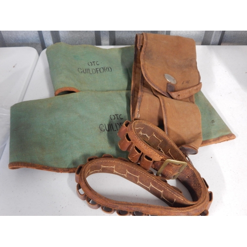 Pair of cloth rifle cases and a shotgun cartridge belt