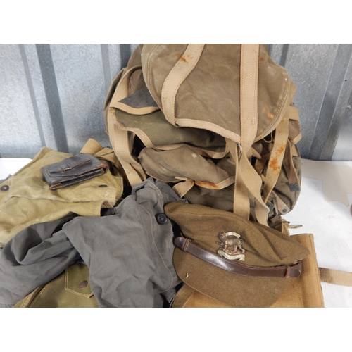 A box containing a WW1 officers cap and a 1944 dated rucksack plus ...