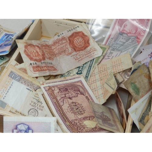 Large selection of banknotes in a vintage box