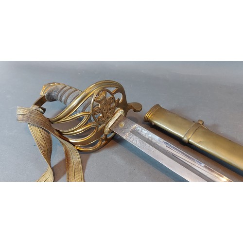 A Victorian officers sword with brass hilt and scabbard, blade length ...