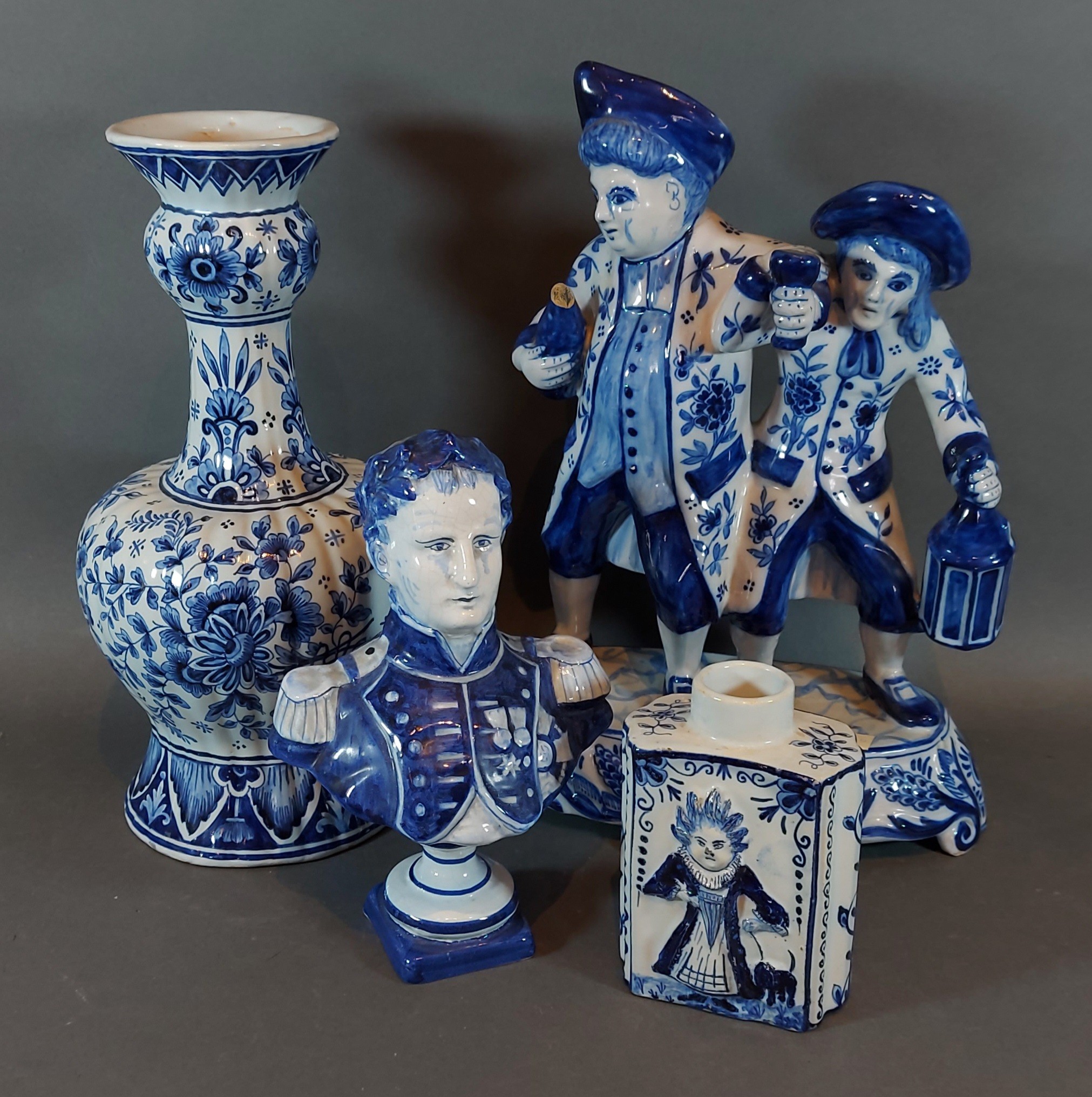 A Delft blue and white decorated bottle neck vase together with a ...
