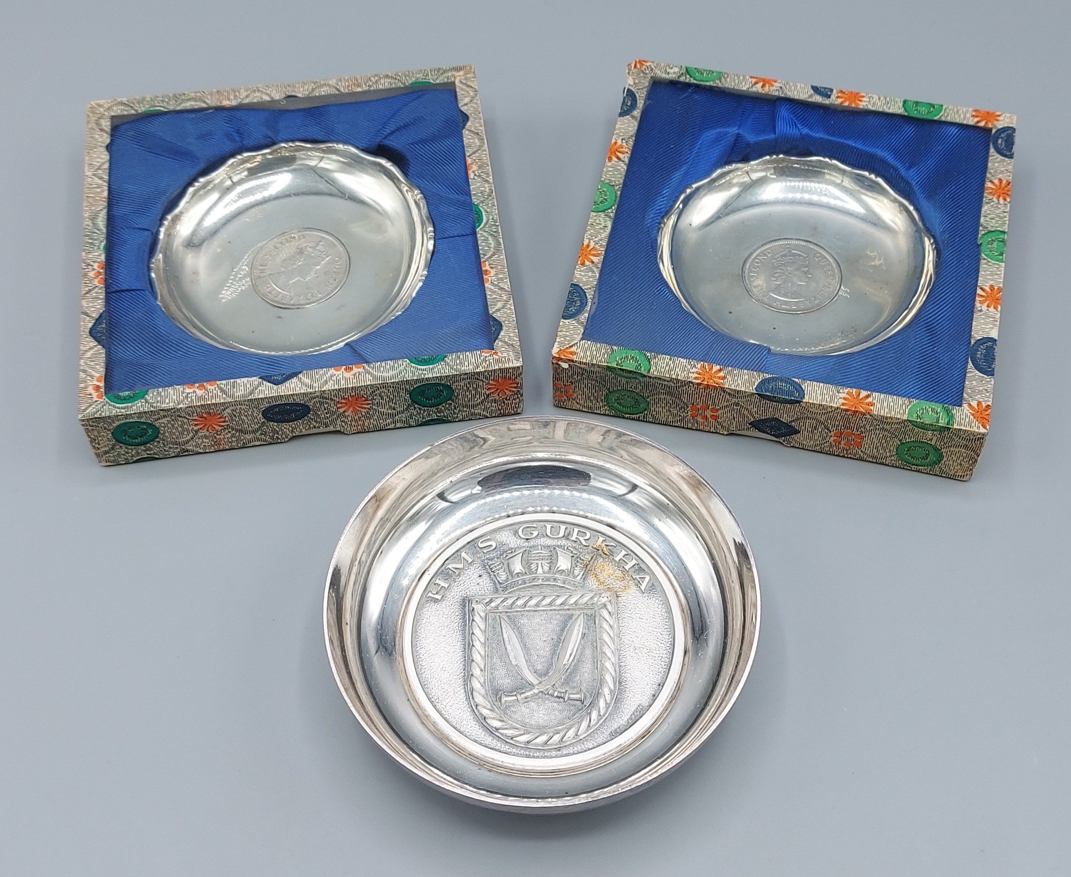 A pair of Sterling silver coin inset dishes together with a ...